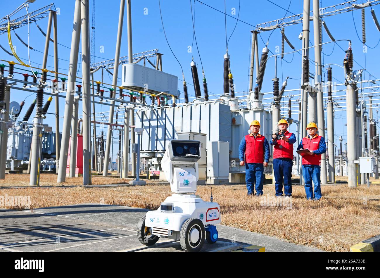 A 5G intelligent inspection robot and staff use a drone to conduct a ...