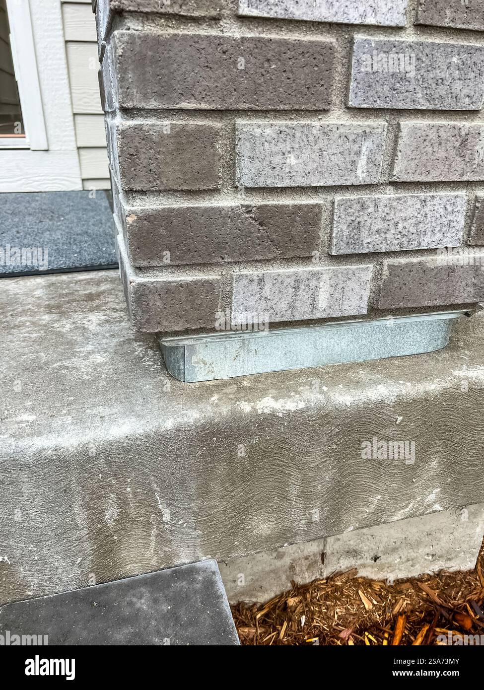 Brick Column Base with Metal Flashing and Concrete Stock Photo - Alamy