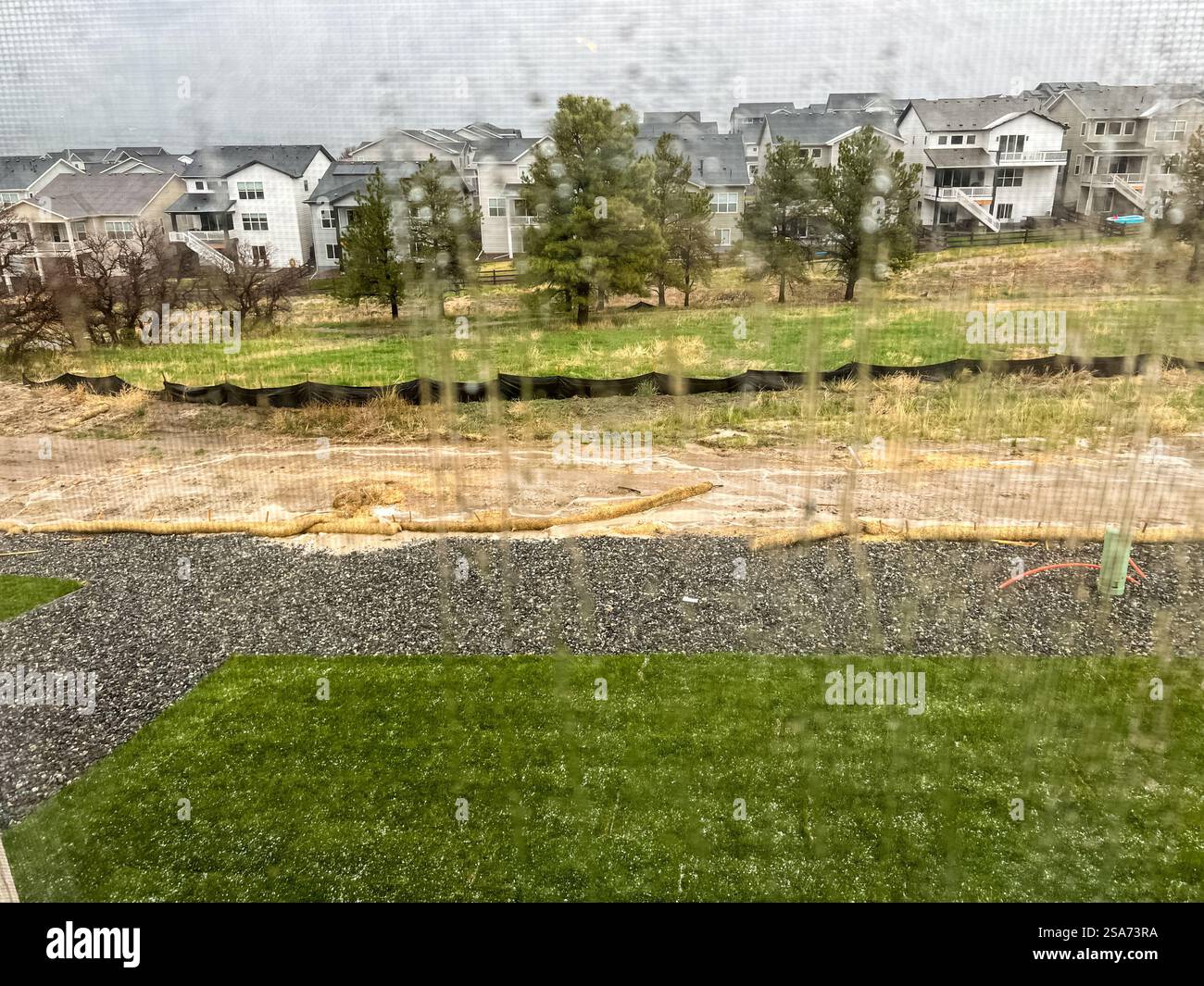 Rainy Day View Through Window in Suburb Stock Photo - Alamy
