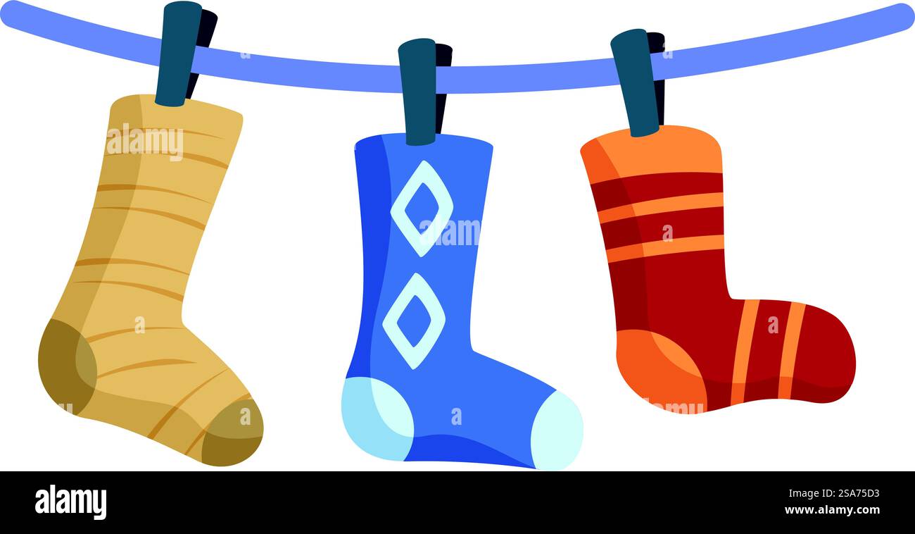 Three colorful socks are hanging on a clothesline, drying after being ...