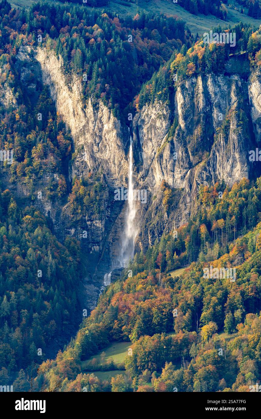 A waterfall with fall foliage color near Brienz, Switzerland, Europe ...