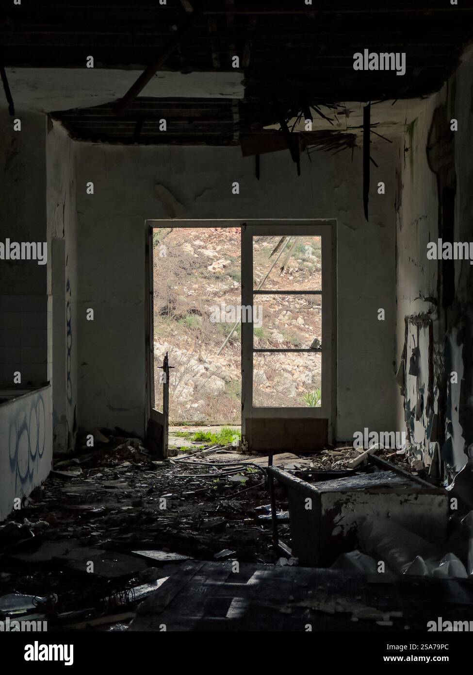 Abandoned Building Interior with Broken Ceiling, Open Window, and Piles ...