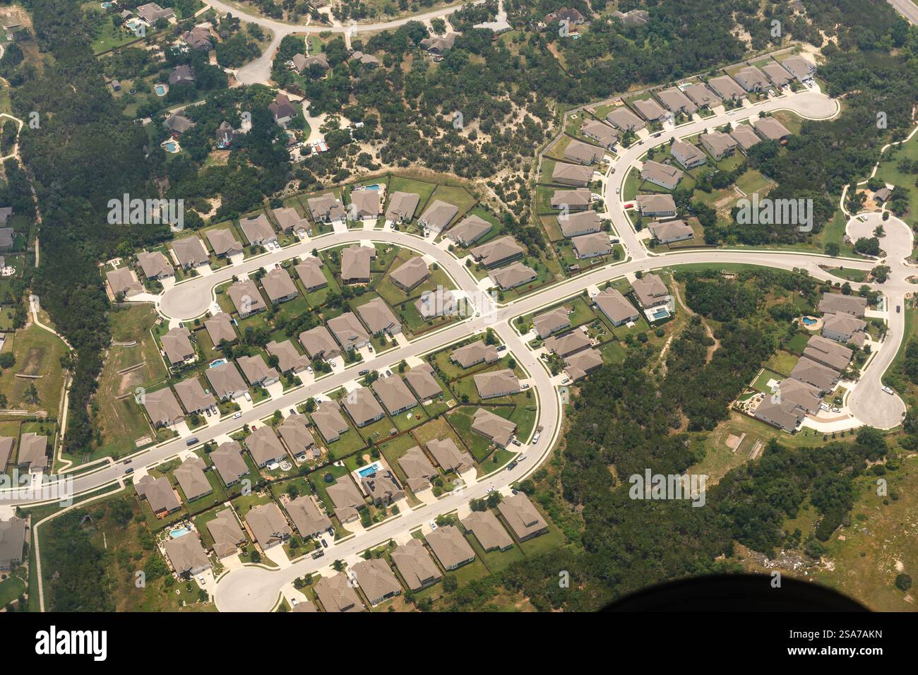 Aerial view of pattern of houses in tract housing suburban subdivision ...