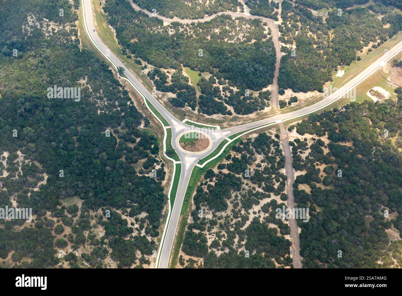 Aerial view of 3 roads converging on a highway roundabout Stock Photo ...