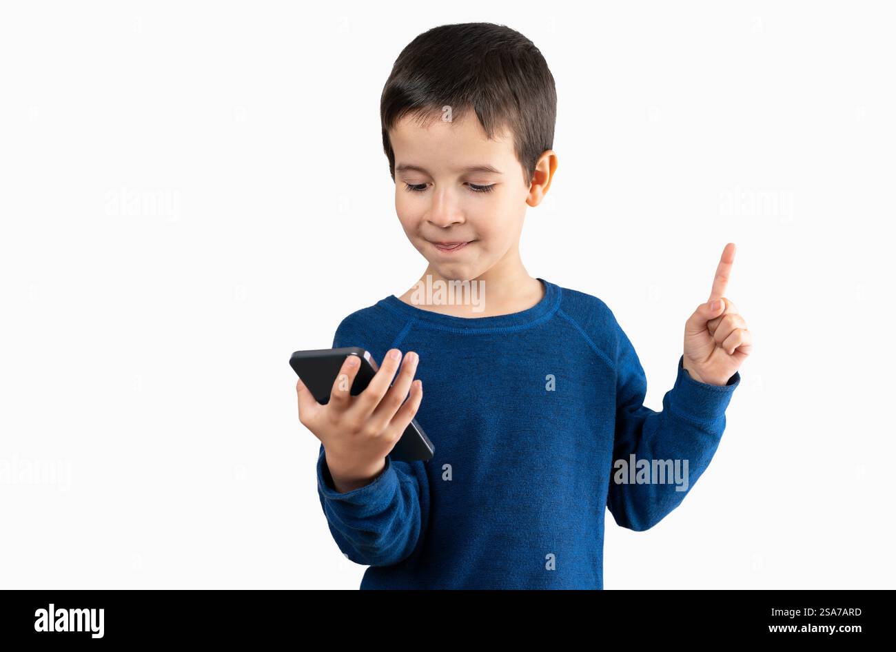 Child texting using a smartphone over isolated background very happy ...