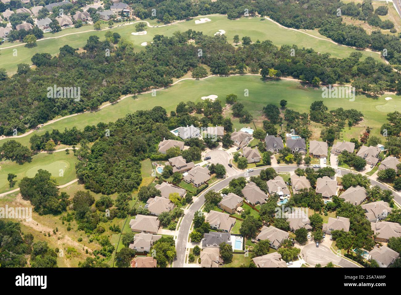 Aerial view of pattern of houses in tract housing suburban subdivision ...