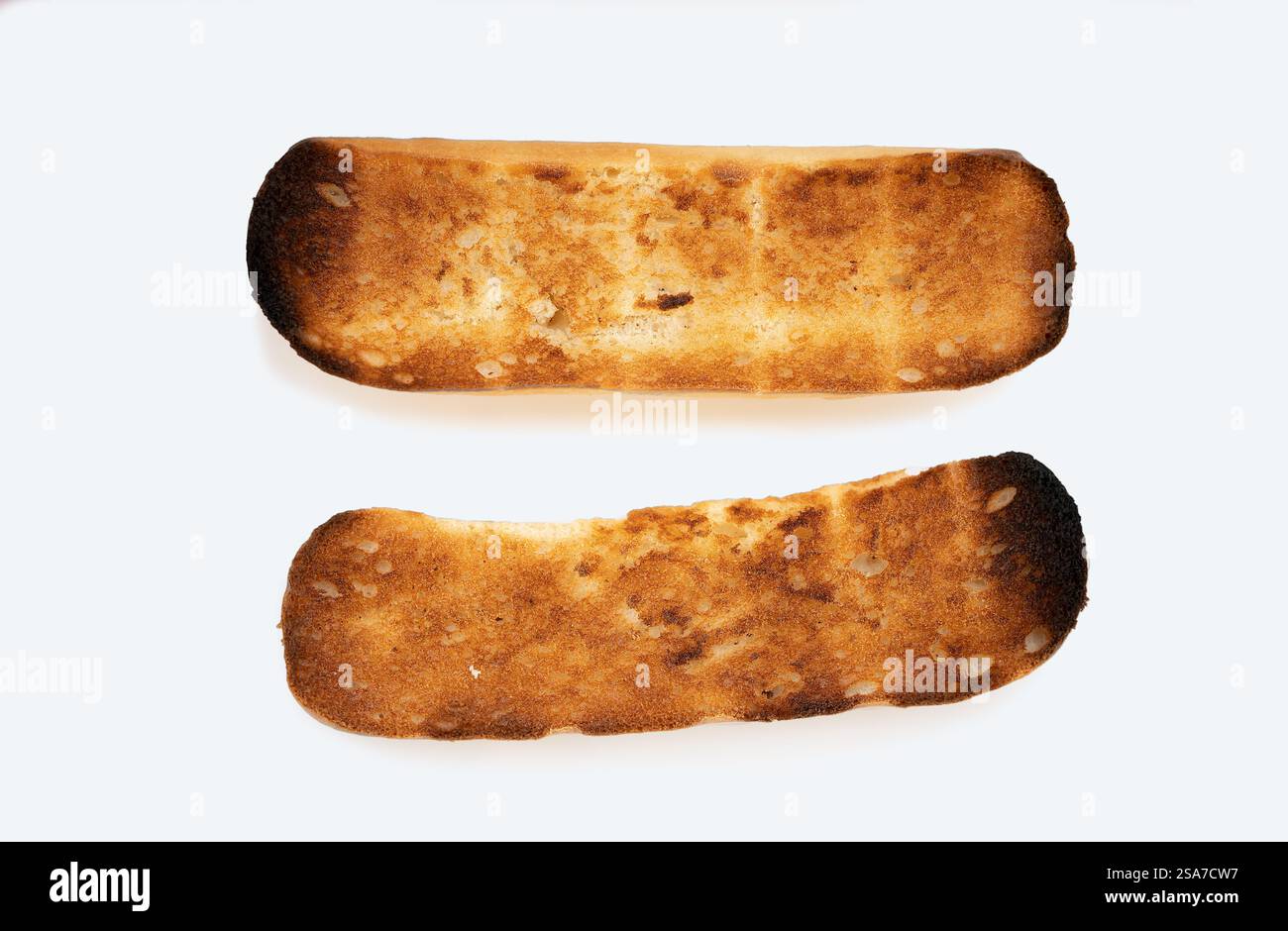 Two burnt toast slices of bread Stock Photo - Alamy