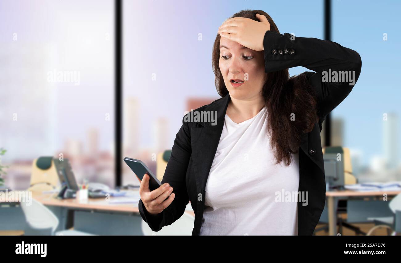 Frustrated office woman texting hi-res stock photography and images - Alamy