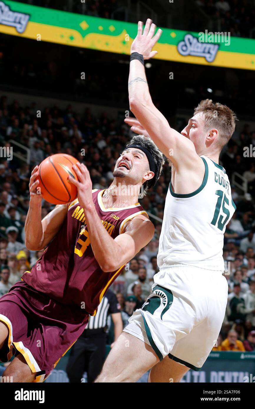 Minnesota forward Dawson Garcia (3), left, drives against Michigan ...