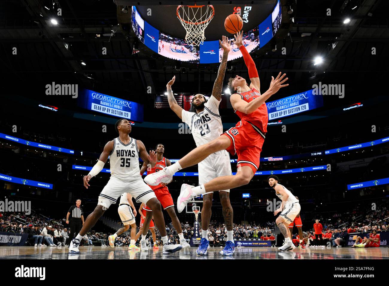 St. John's forward Ruben Prey, right, goes to the basket against ...
