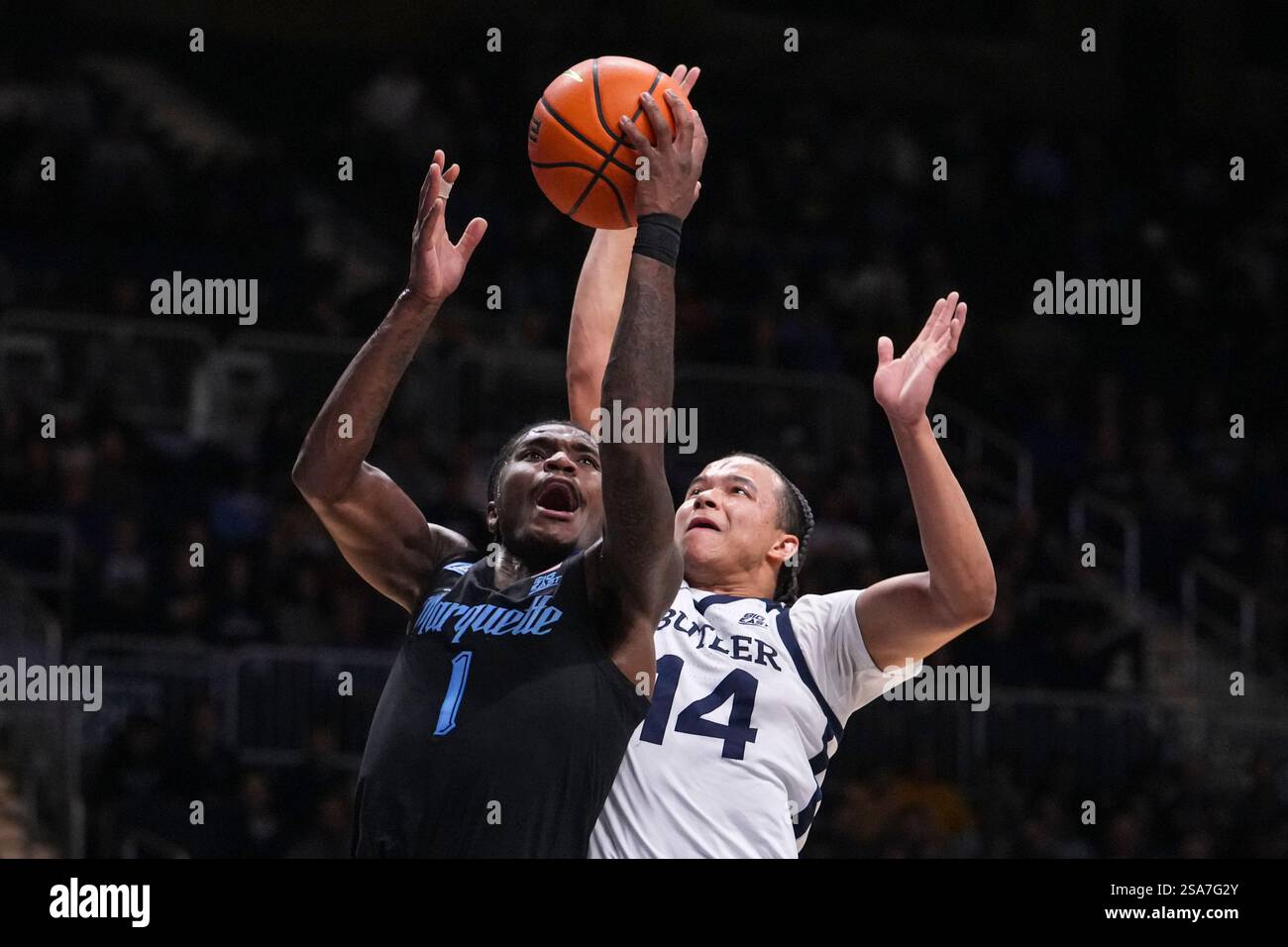 Marquette guard Kam Jones (1) shoots in front of Butler guard Landon ...