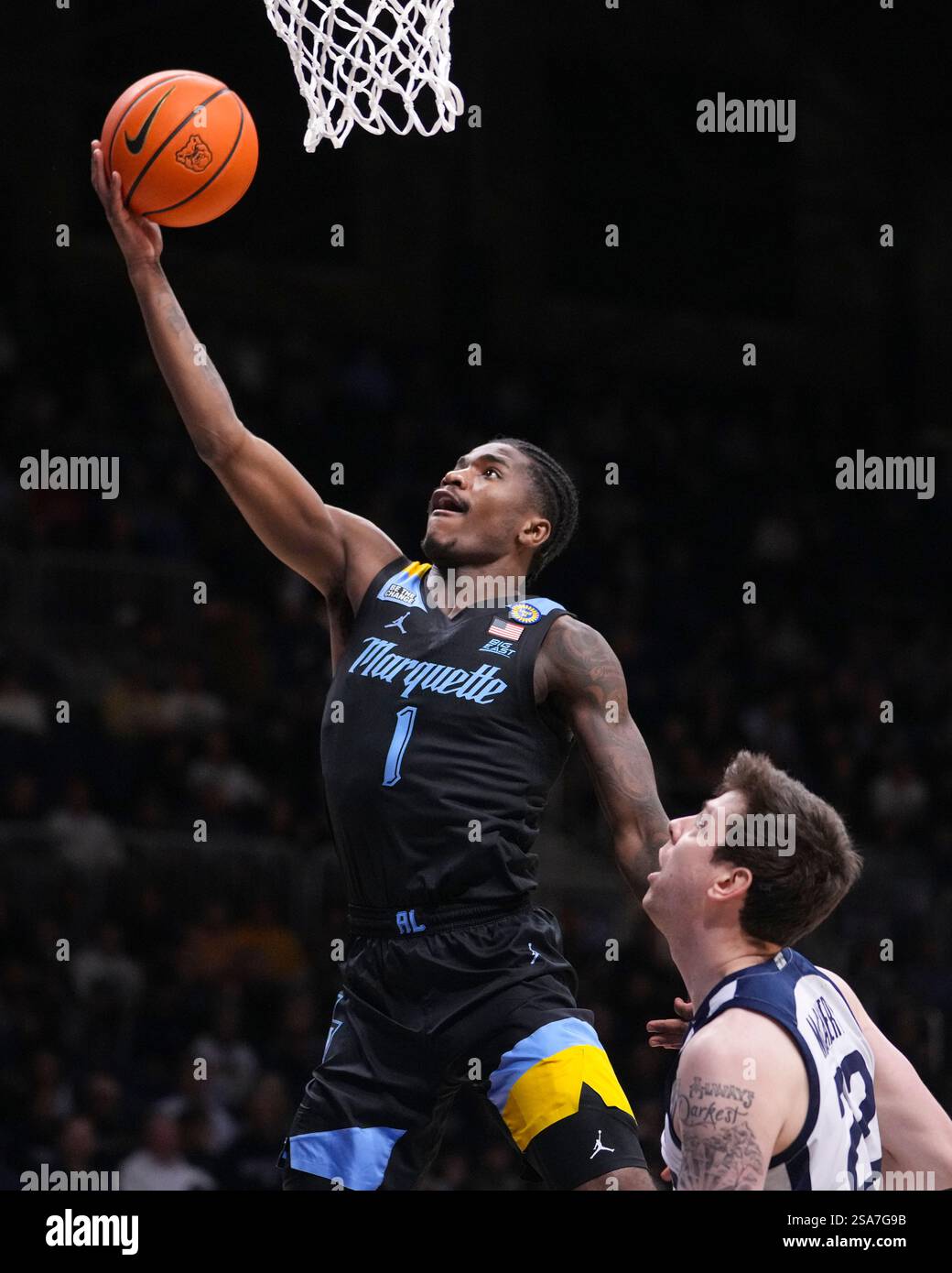 Marquette guard Kam Jones (1) shoots over Butler forward Patrick ...