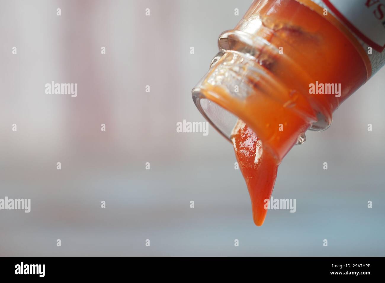 Ketchup pouring from a glass bottle in the kitchen Stock Photo - Alamy