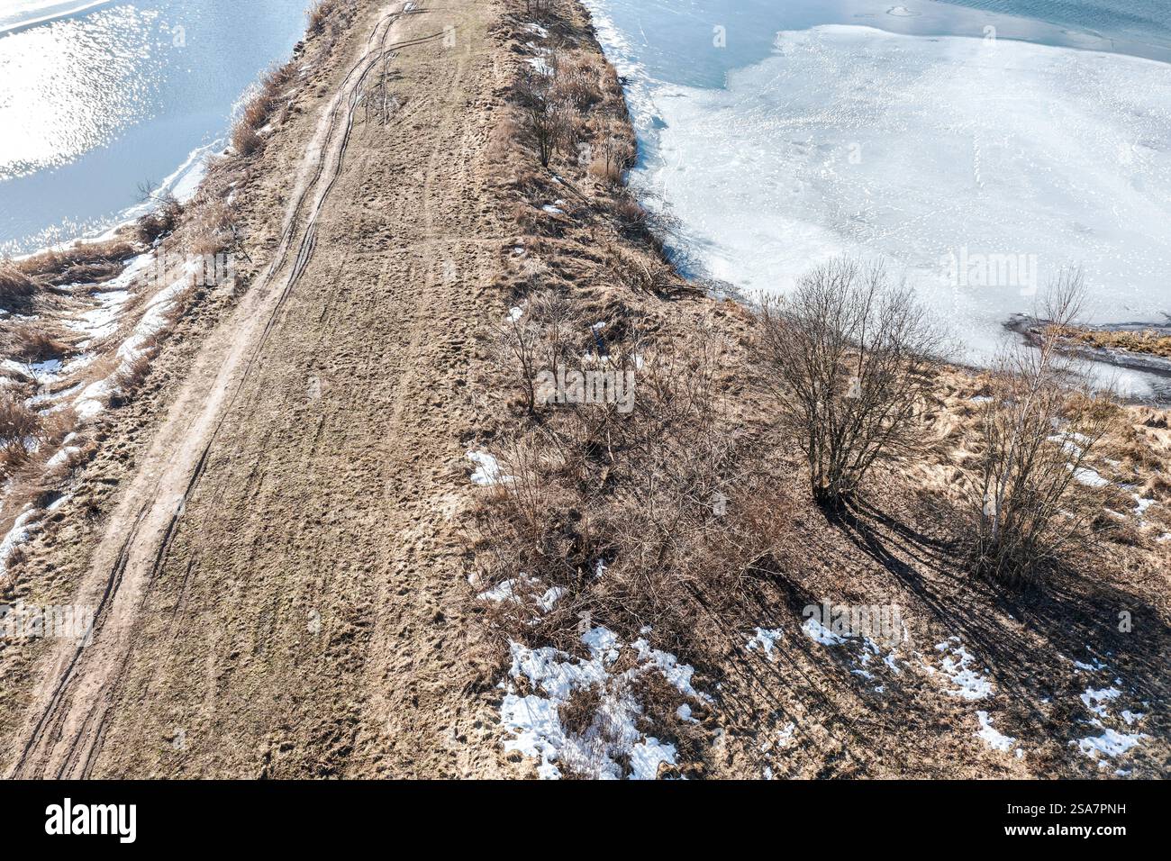 rural landscape. river with melting ice on sunny spring day. aerial ...