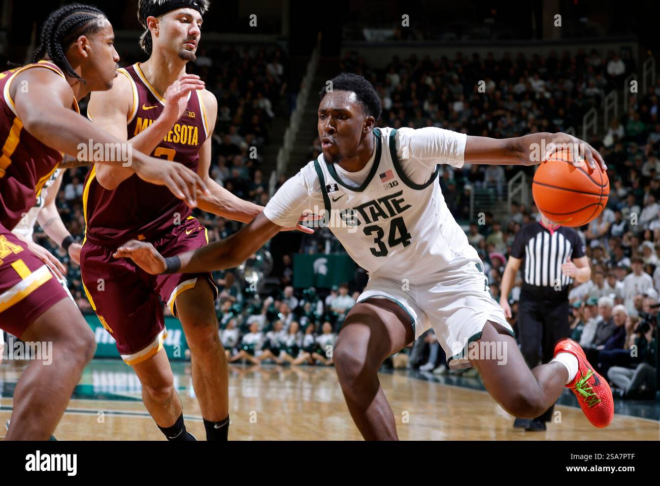 Michigan State forward Xavier Booker (34) drives against Minnesota ...