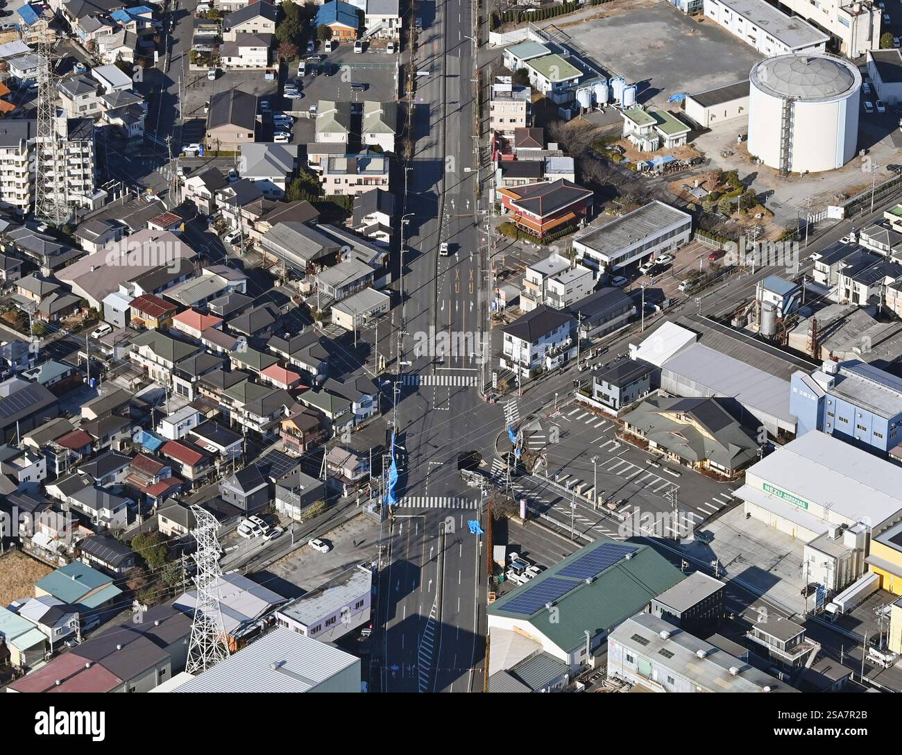 An aerial photo shows sinkholes are seen at an intersection in Yashio ...