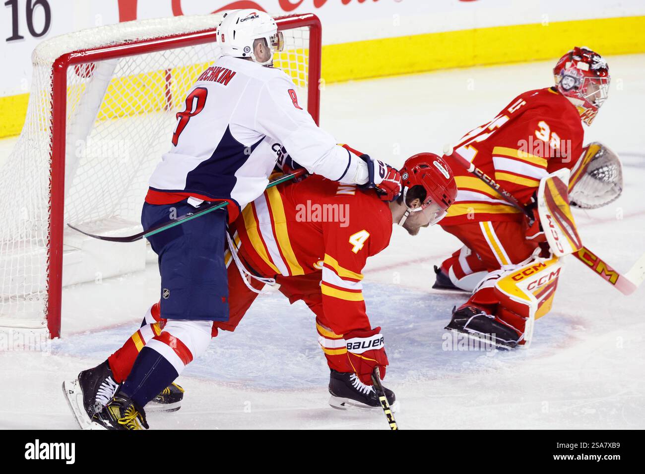 Washington Capitals' Alex Ovechkin, left, pushes Calgary Flames' Rasmus ...