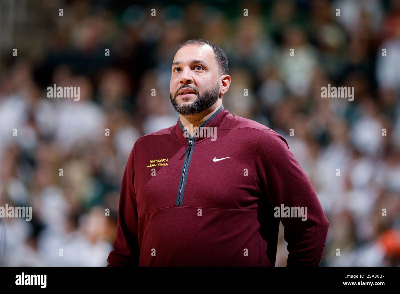 Minnesota coach Ben Johnson watches during an NCAA college basketball ...