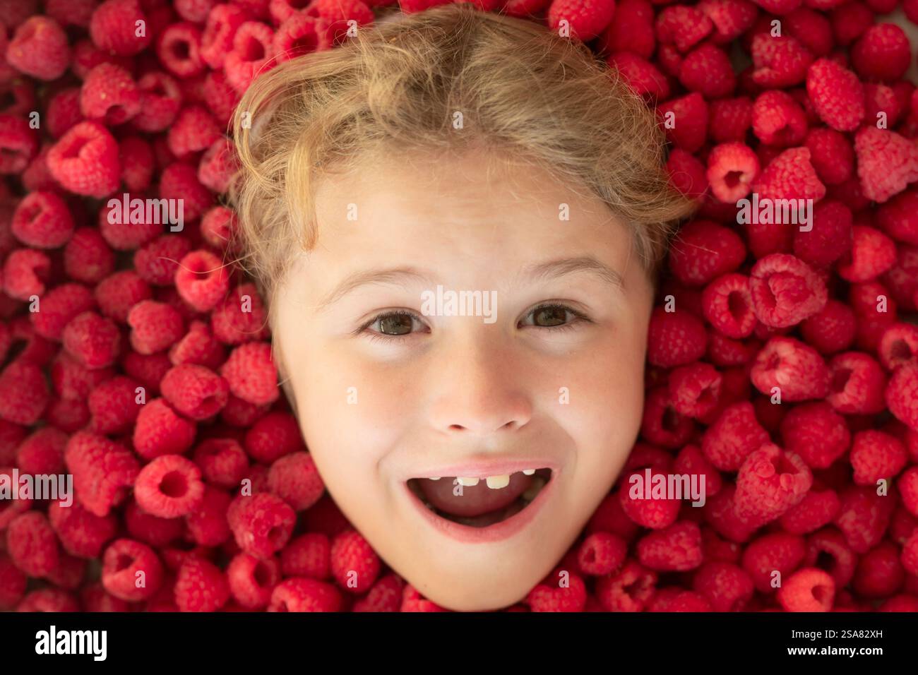 Raspberry isolated. Raspberries child face close up. Top view photo of ...