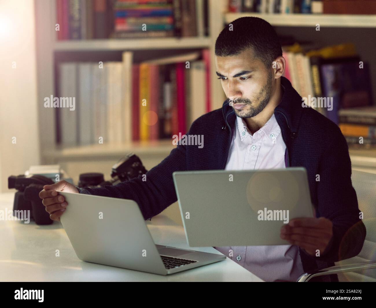 Laptop, businessman and photographer with tablet in home, editing and ...