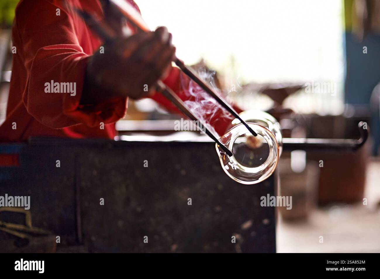 Hands, worker and tools in glass factory for manufacturing, production ...
