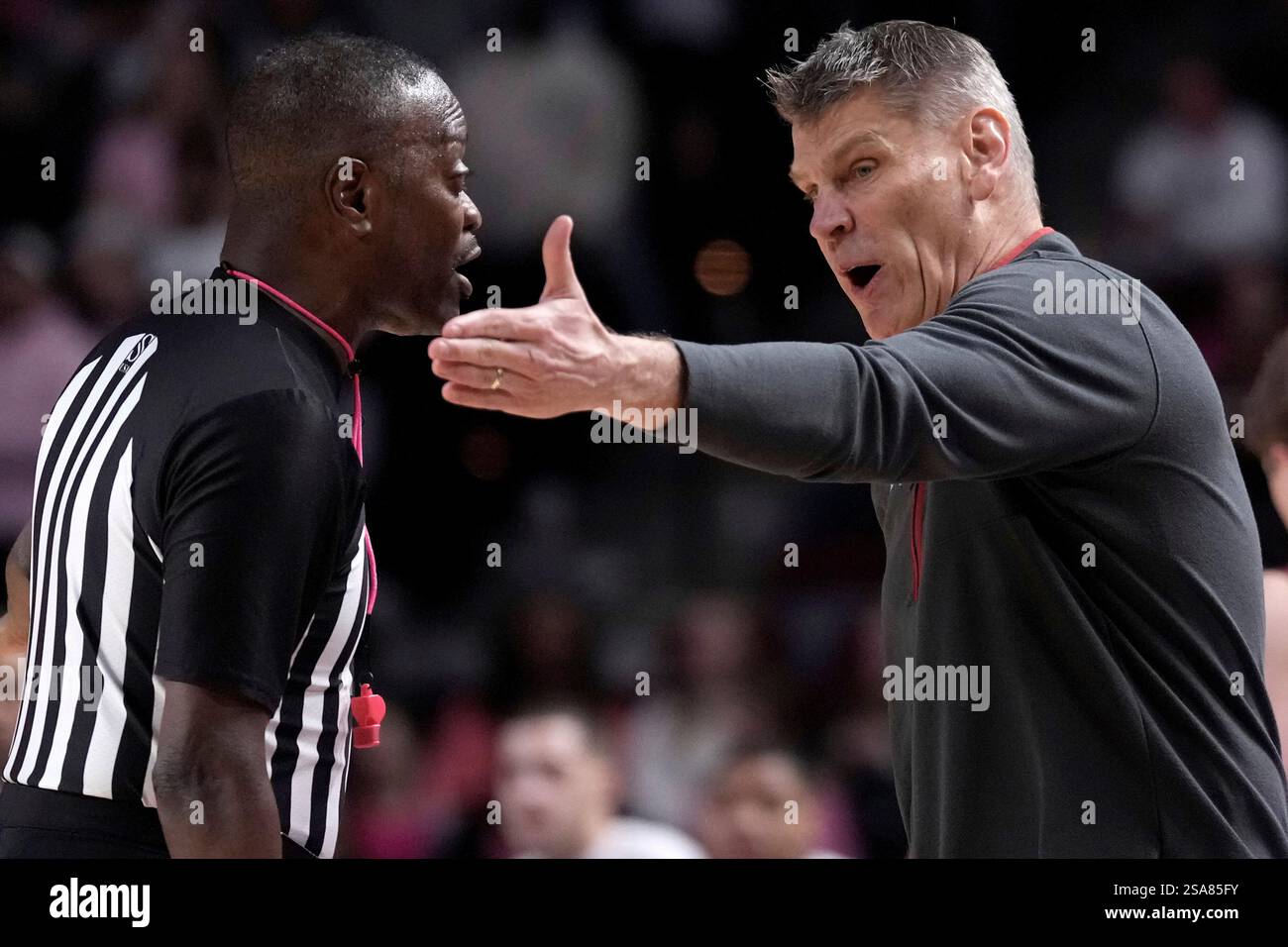 Oklahoma head coach Porter Moser, right, argues a call with a referee ...