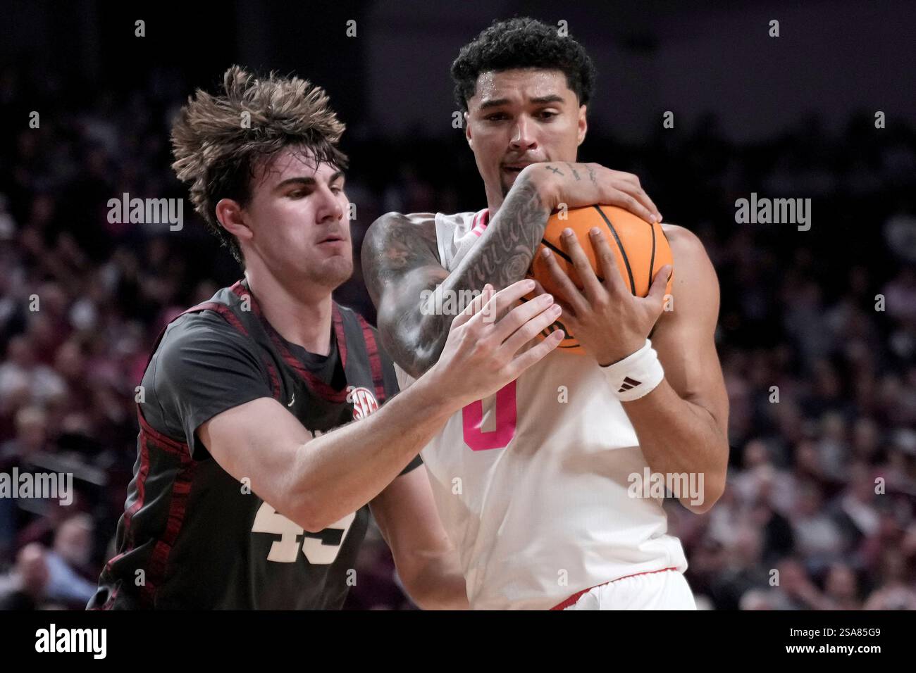 Texas A&M guard Jace Carter (0) secures a rebound from Oklahoma forward ...