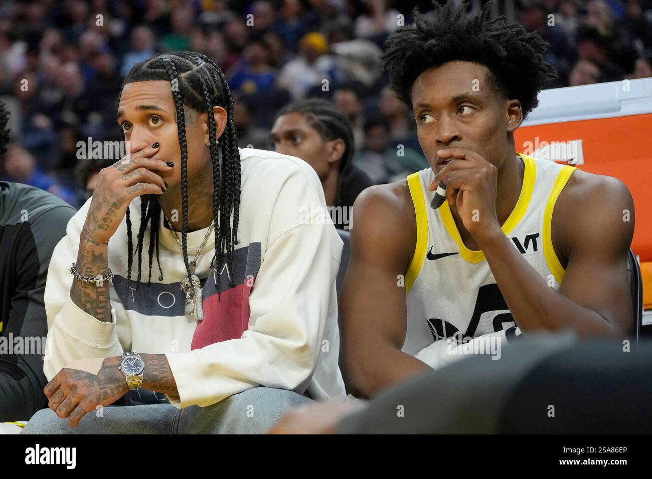 Utah Jazz guard Jordan Clarkson, left, and guard Collin Sexton sit on ...