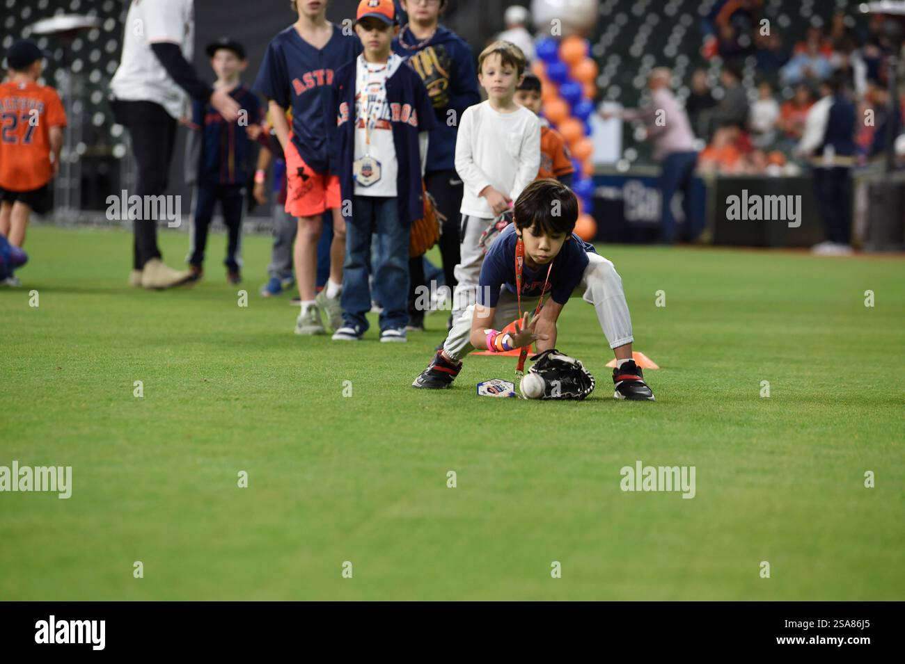 Fans enjoying time on the field during the 2025 Houston Astros FanFest ...