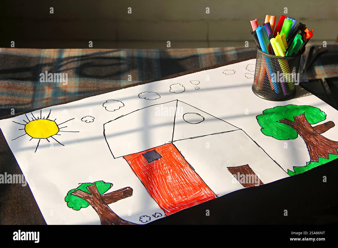 Beautiful, colorful, incomplete artwork of a house, trees, sun, and ...