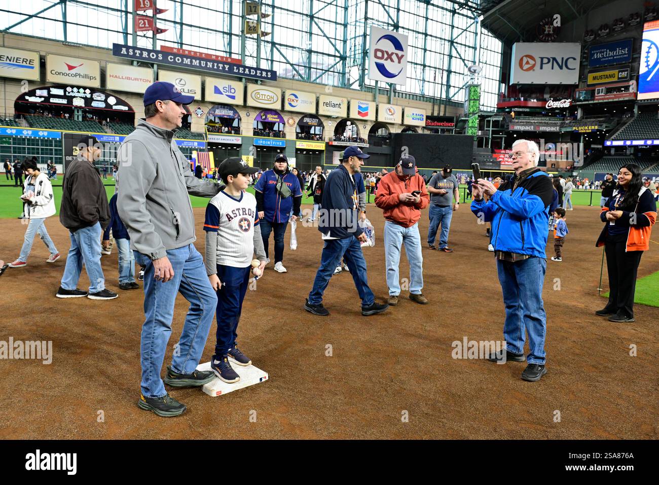 Fans enjoying time on the field during the 2025 Houston Astros FanFest ...