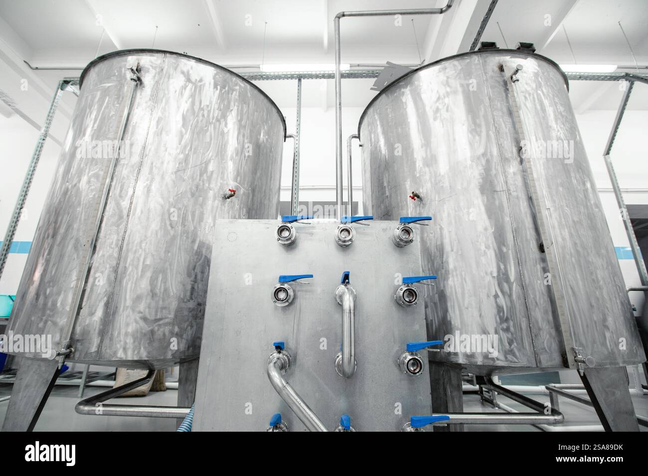Metallic fermentation tanks in a brewery showcasing industrial design ...