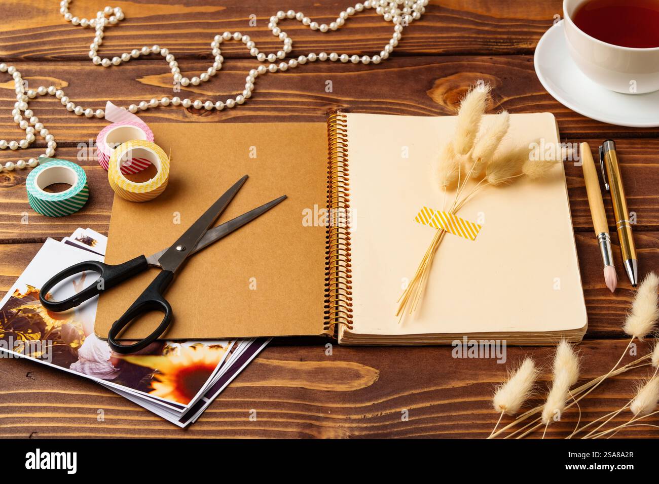 Creative workspace with scrapbook materials and decorative elements ...