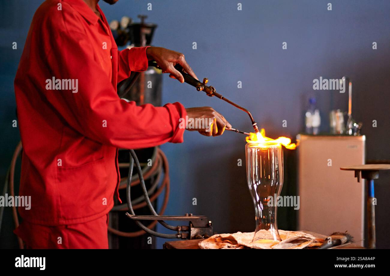 Glassblowing, heat and man with blowtorch, shaping and creative for ...