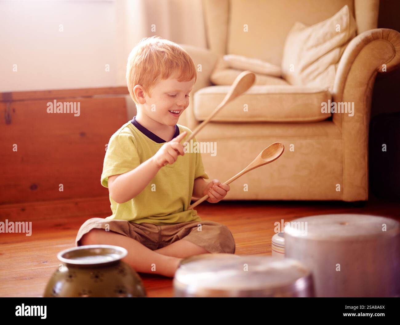 Home, drum and boy with pots, pans and playful with noise, energy and ...