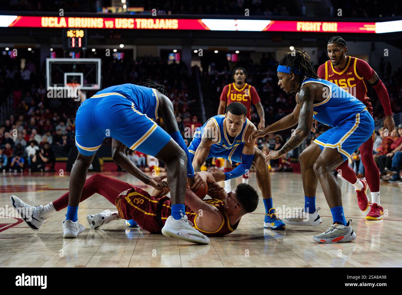 UCLA Bruins guard Kobe Johnson (0) fights for possession with USC ...