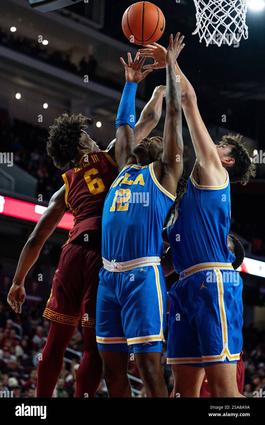 UCLA Bruins guard Sebastian Mack (12) reaches for a rebound against USC ...