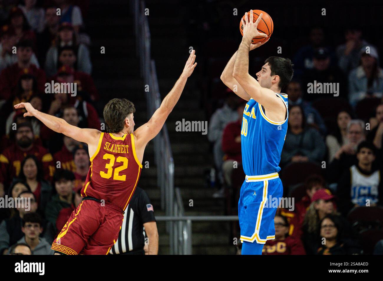 UCLA Bruins guard Lazar Stefanovic (10) shoots over USC Trojans guard ...
