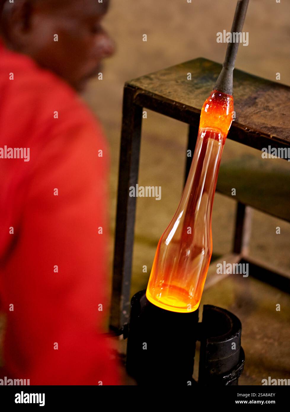 Glassblower, tools and black man in warehouse, productivity and skills ...