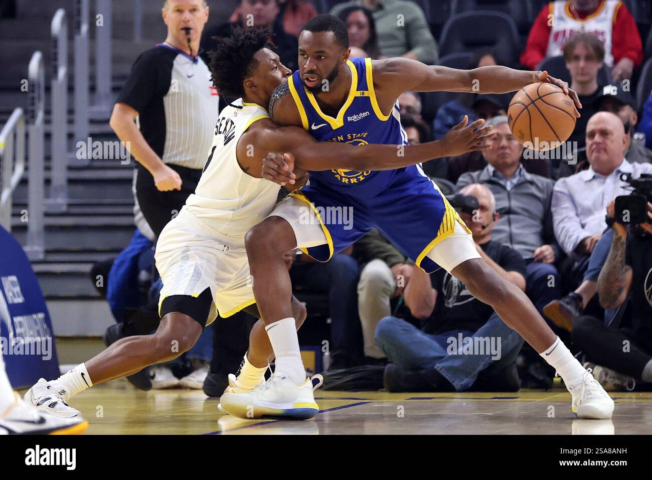Golden State Warriors' Andrew Wiggins, right, keeps the ball away from ...