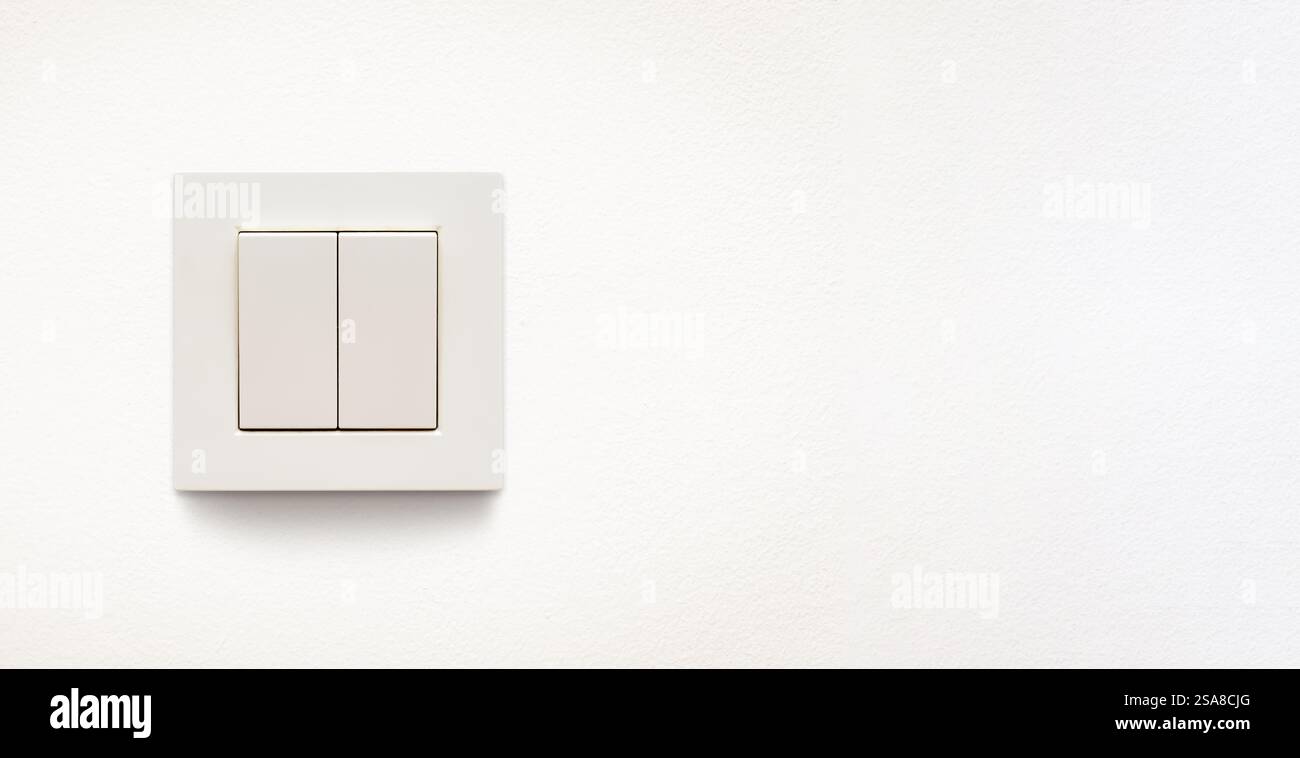 Cream colored wall mounted cream colored double light switch Stock ...