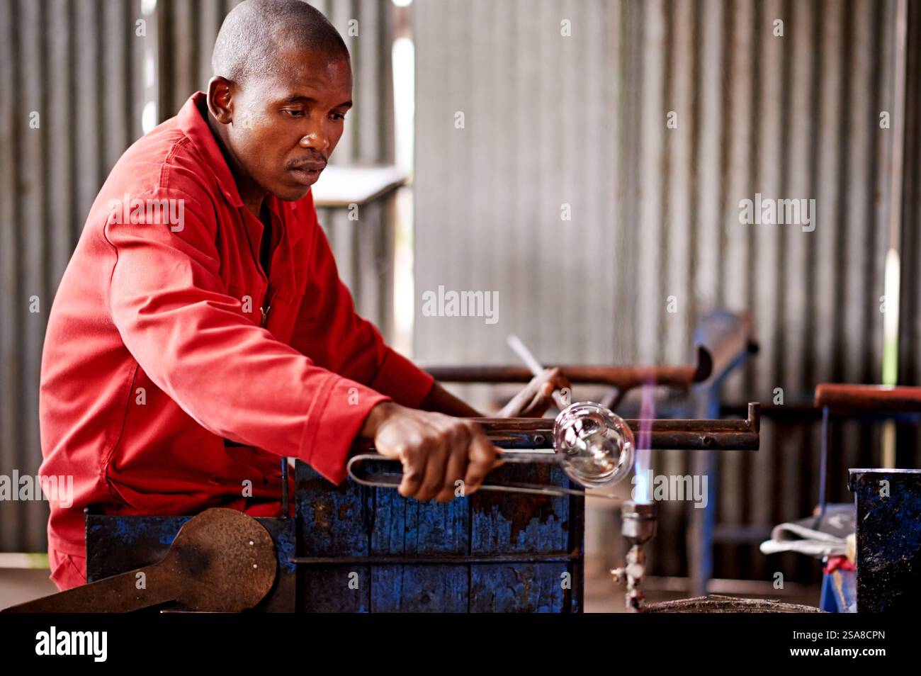 Black male worker creating glass hi-res stock photography and images ...
