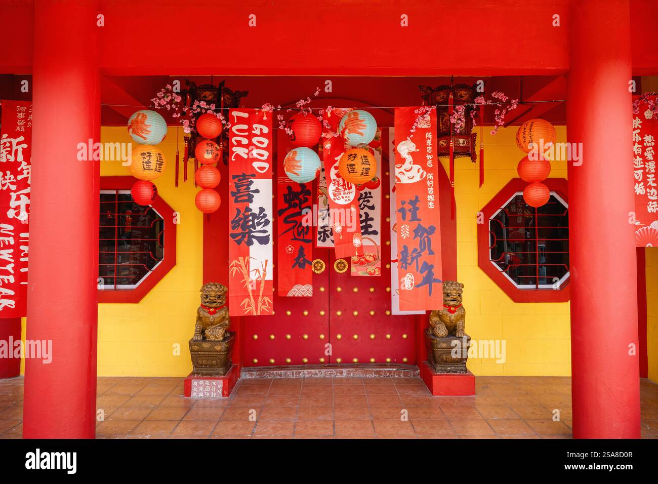 Temple entrance adorned with Chinese New Year decorations, including ...