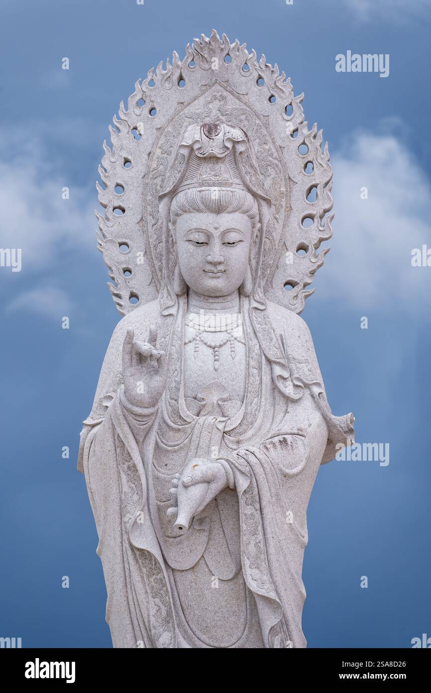 A detailed stone statue of Guanyin at Peak Nam Toong Temple in Sabah ...