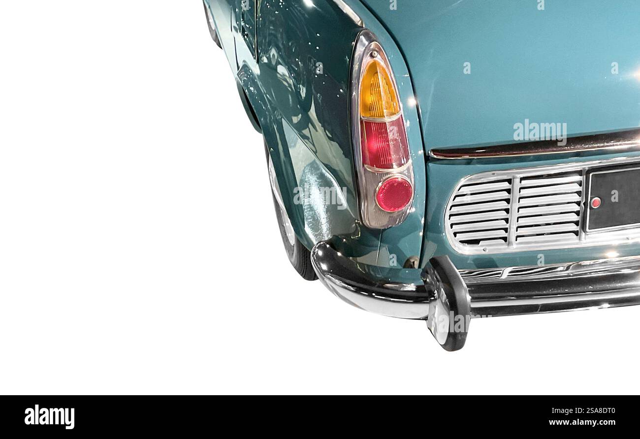 Rear section of a vintage teal car featuring a distinctive tail light ...