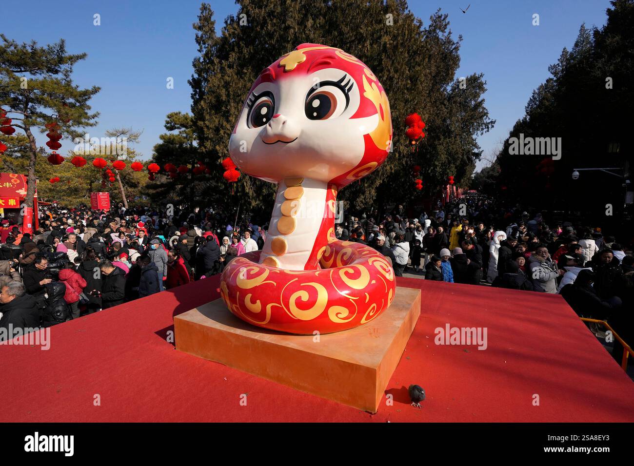 A snake figure is displayed as people gather at the Ditan Temple Fair ...