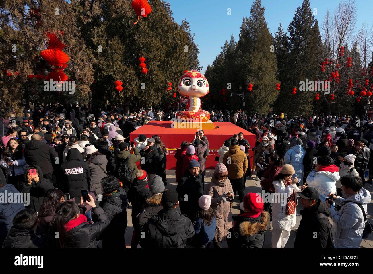 A snake figure is displayed as people gather at the Ditan Temple Fair ...