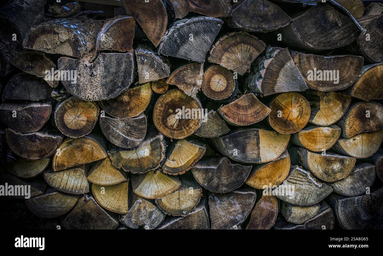 A pile of stacked chopped wood ready for winter Stock Photo - Alamy