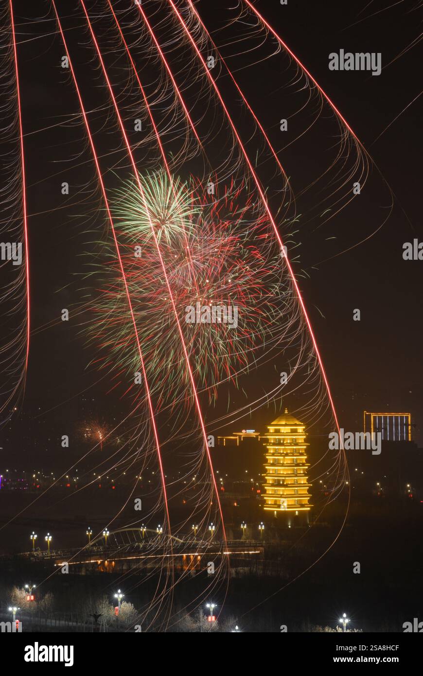 People hold a fireworks and light show at Hongyan Square to celebrate ...
