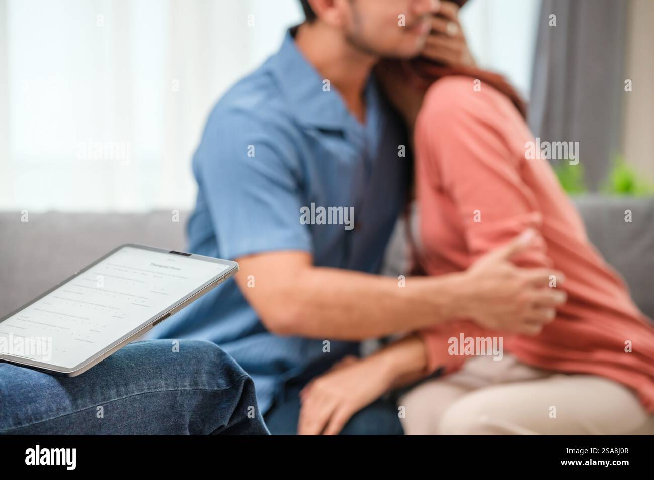 asian couple embraces happily after a productive counseling session ...